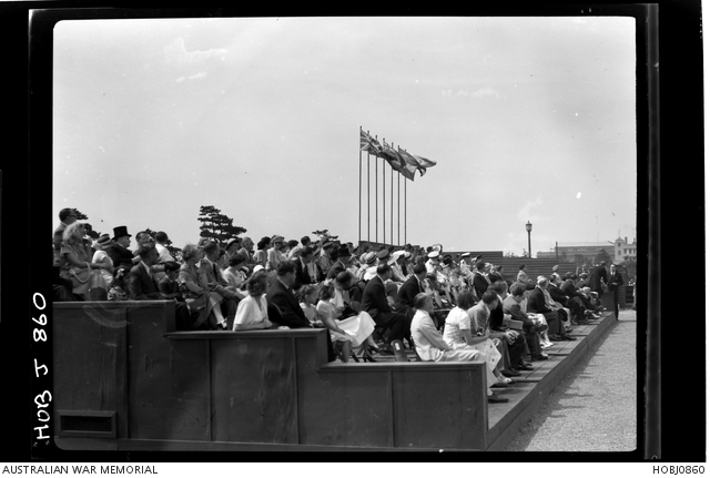 A crowd of spectators watch a British Commonwealth Occupation Force ...