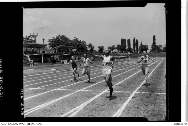 A sprinter from the United States Army's 25th Infantry Division crosses ...
