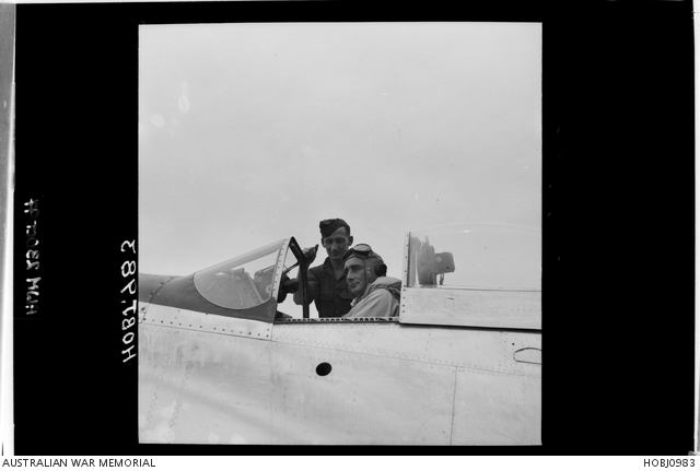 A33217 Pilot Kenneth Edward (Ken) Royal of 77 Squadron RAAF,sits in the ...