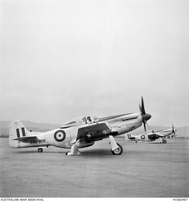 Two P51 Mustang aircraft of 77 Squadron RAAF sit on the tarmac at ...