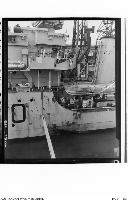 Port side view of the Royal Navy destroyer HMS Comus (D20) in dry dock ...