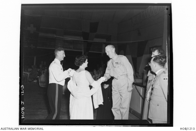 Lieutenant Colonel Ramsay in evening dress uniform, escorts Moira Cole ...