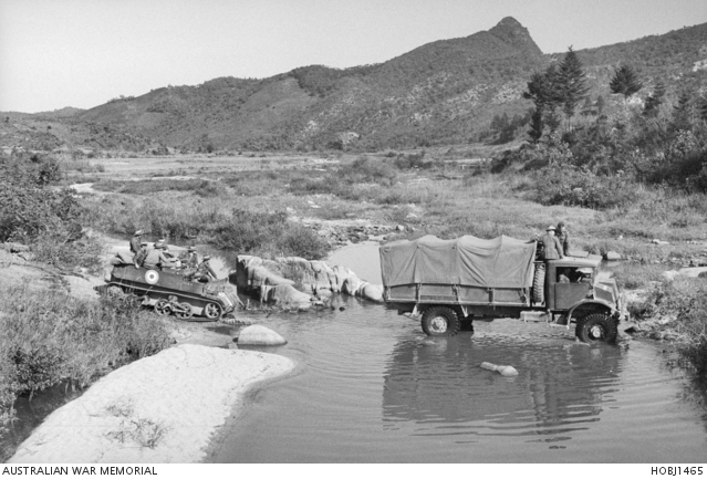 A truck and Bren gun carrier, part of a 3rd Battalion, The Royal ...