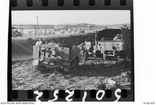 Military vehicles belonging to the United Nations (UN) force stop by a ...