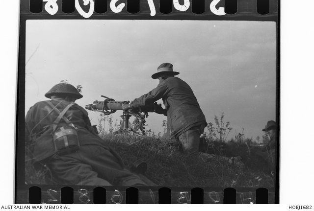 Three unidentified members of a machine gun platoon of the 3rd ...