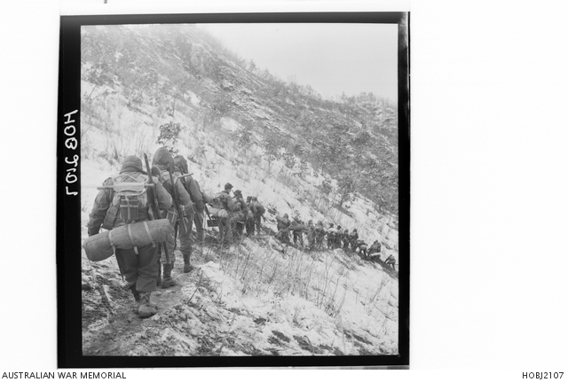 Walking over snow covered mountains, an Australian mortar fire control ...