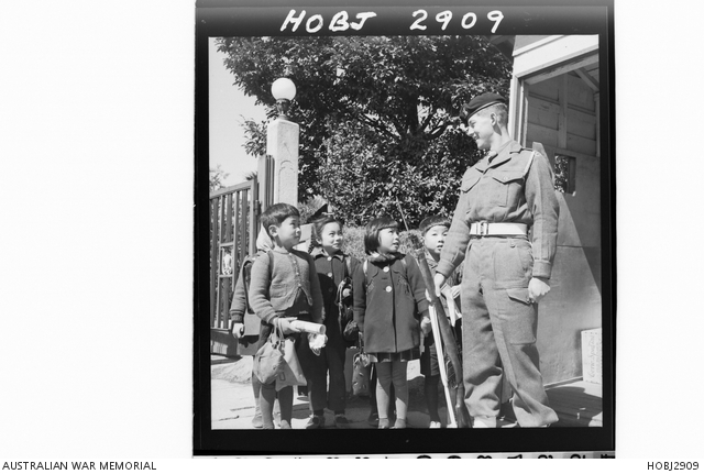 An unidentified British soldier stands guard at a gateway outside an ...