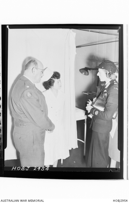 Lady Edwina Mountbatten (right) talks with an unidentified officer ...