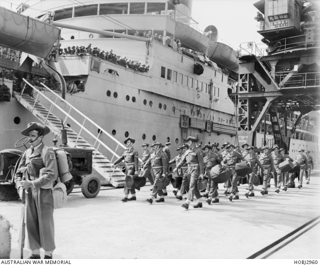 The troopship HMT Devonshire has arrived in Kure Harbour, carrying on ...