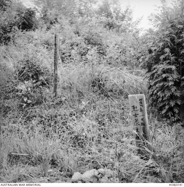 Kapyong, South Korea. June 1952. Wooden markers showing two Chinese ...