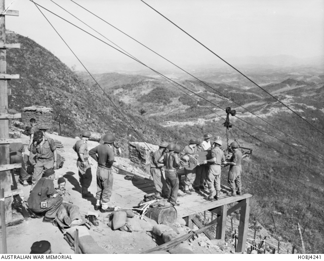 At the platform of the flying fox, a wounded soldier of D Company, 3rd ...