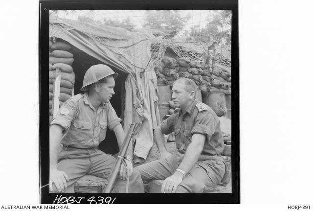 Corporal H. A. (Curley) Haines of Ascot Vale, Vic (left), and the 3rd ...