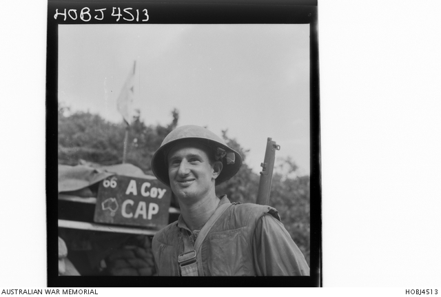 Informal portrait of a smiling stretcher bearer, Private Ray Tinker ...