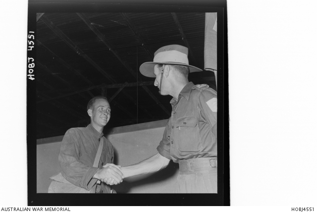 There is a wealth of feeling in the handshake as Private Jim McCulloch ...