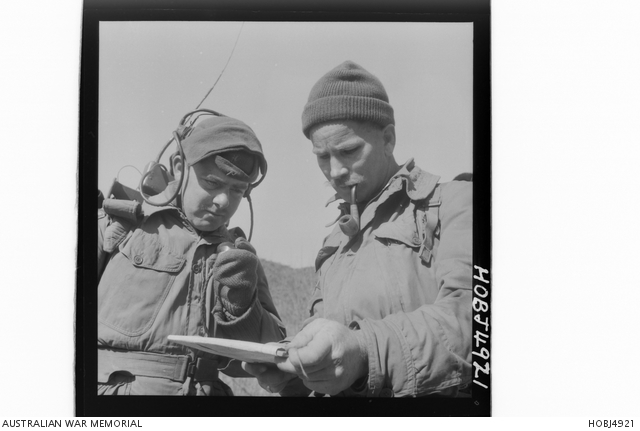 Pipe smoking Corporal (Cpl) H. A. (Curley) Haines, of Ascot Vale, Vic ...