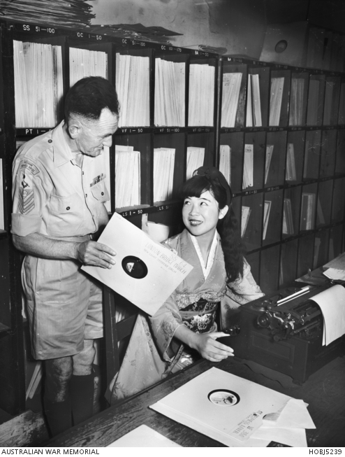 Kure, Japan. 5 August 1954. Helping Japanese typist Miss Hsuneko ...