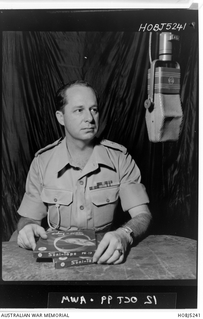 Kure, Japan. 5 August 1954. At work behind the microphone is Captain ...