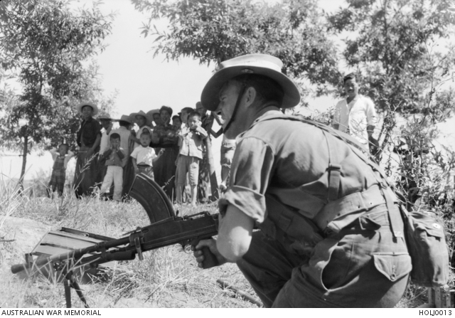 Watching a battle exercise near the Korean truce line, these small ...