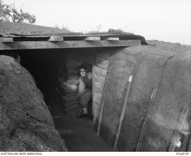 Coming out of his underground bunker during a battle exercise on the ...
