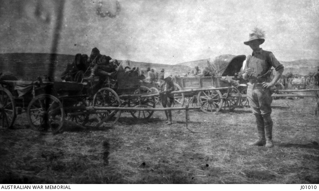 An Australian Light Horseman stands near captured Turkish transport ...