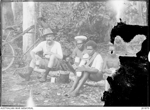 Informal portrait of a Road Master, Private Luxmoore and his assistants ...