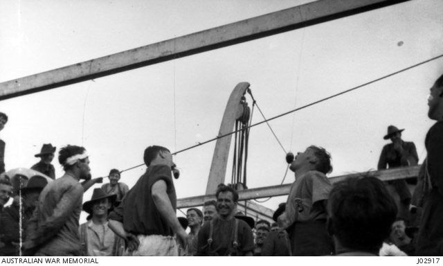 THE BUN EATING CONTEST DURING THE SPORTS ABOARD THE S.S. "ORCA" WHEN ...