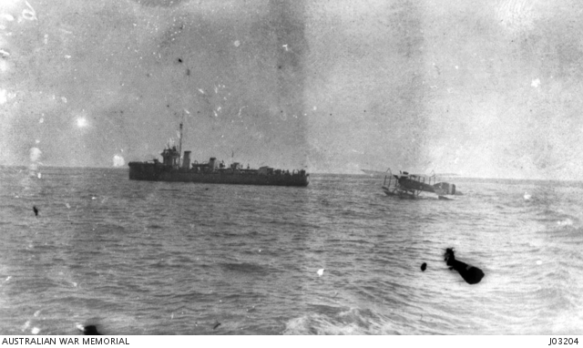 A DISABLED BRITISH SEAPLANE BEING ASSISTED BY A DESTROYER IN THE ...