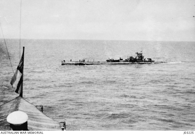 HMAS/M J7 disabled in the Indian Ocean, seen from HMAS Australia, which ...