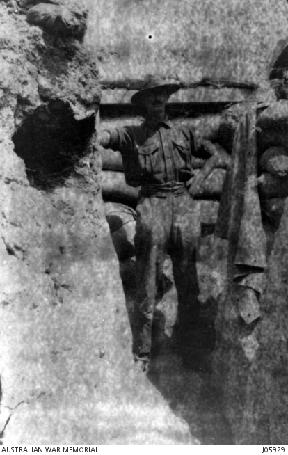 AN AUSTRALIAN STANDING IN A TRENCH AT ANZAC. THE PICTURE GIVES AN IDEA ...