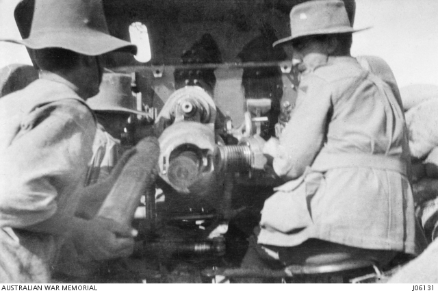 A GUN OF THE HUGHES BATTERY IN ACTION IN THE FRONT LINE AT ANZAC, ON ...