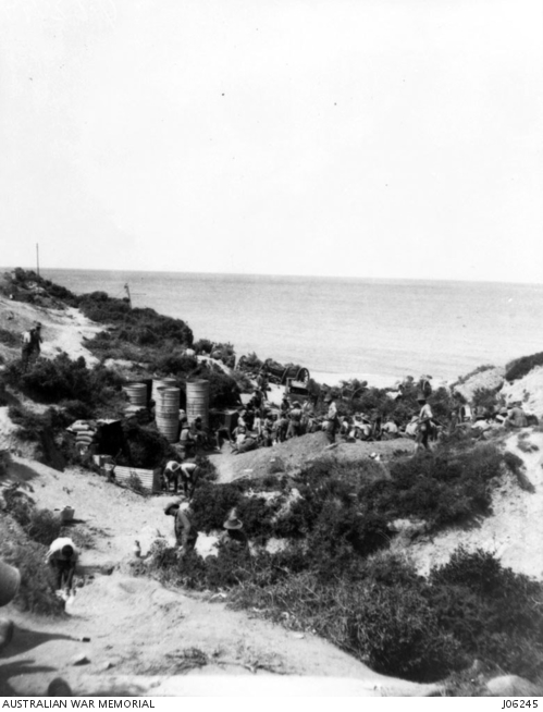 GALLIPOLI, TURKEY. MEN LINED UP WAITING FOR WATER TANKS AT THE FOOT OF ...