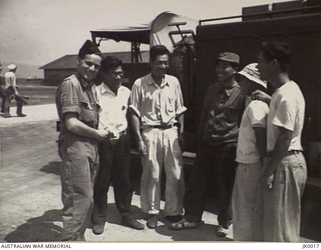 IWAKUNI, JAPAN. C 1951. THE JAPANESE CREW OF AN RAAF FIRE FIGHTING UNIT ...