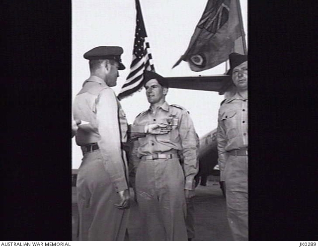 KIMPO, SOUTH KOREA. 1952-05-25. COLONEL WILLIAM CAREY DECORATES RAAF ...