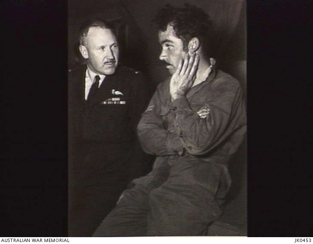 CORPORAL JOE RYAN, PHOTOGRAPHER, CHATS WITH AIR VICE-MARSHAL V. E ...