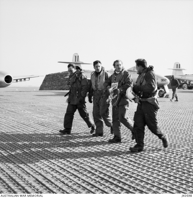 KIMPO, SOUTH KOREA. 1953-02. PILOTS OF NO. 77 SQUADRON RAAF DISCUSS ...