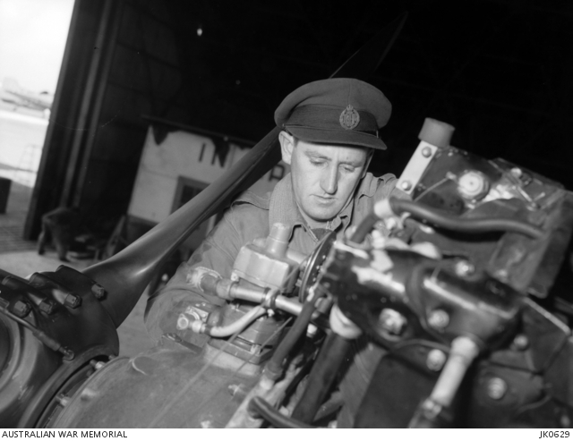 IWAKUNI, JAPAN. 1952. MAKING AN ENGINE CHECK IS CORPORAL ROY PAYNE OF ...