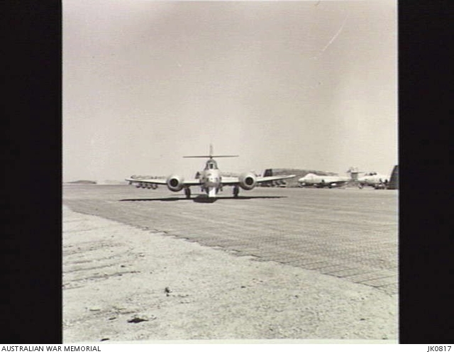 KIMPO, SOUTH KOREA. 1953. A NO. 77 SQUADRON RAAF METEOR LOADED WITH ...
