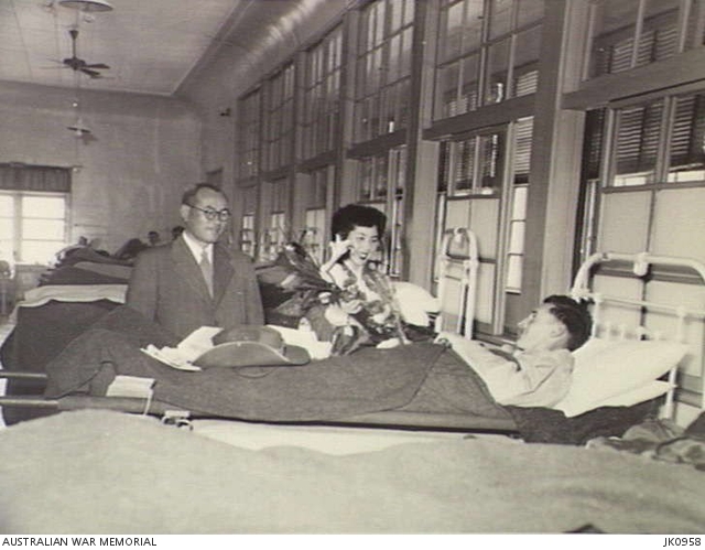 IWAKUNI, JAPAN. 1953-08-06. A RECENTLY EXCHANGED PRISONER OF WAR IS ...