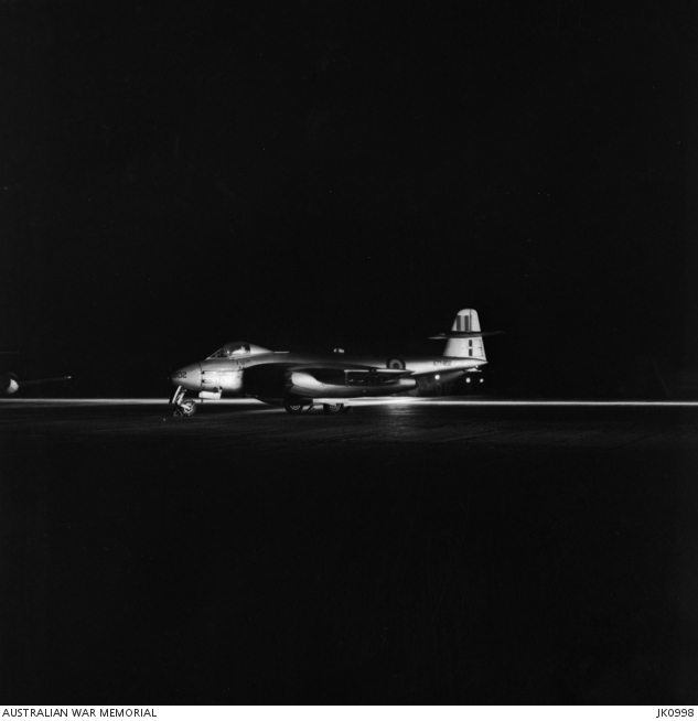 A GLOSTER MK8 METEOR OF NO. 77 SQUADRON RAAF RETURNS AFTER A NIGHT ...