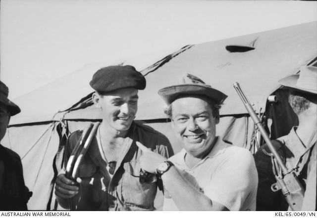 Bien Hoa, Vietnam. 1965-12-31. TV personality Tommy Hanlon Jnr shares a ...