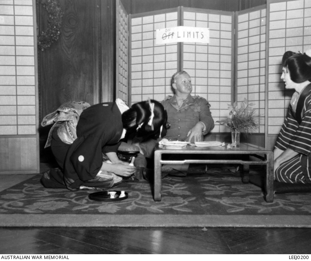 A send-up skit is being performed, probably at a social function ...
