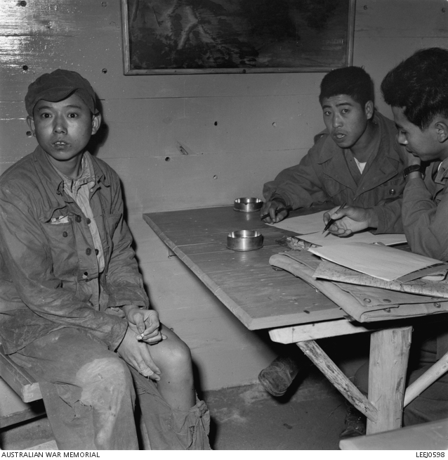 A Chinese prisoner of war (POW) (left), captured on the night of 13-14 ...