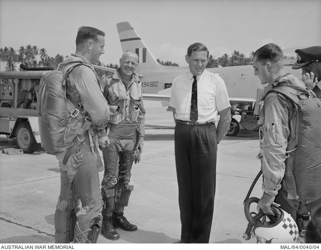 THE MINISTER FOR AIR CHATS TO NO. 77 SQUADRON PILOTS ON THE TARMAC AT ...