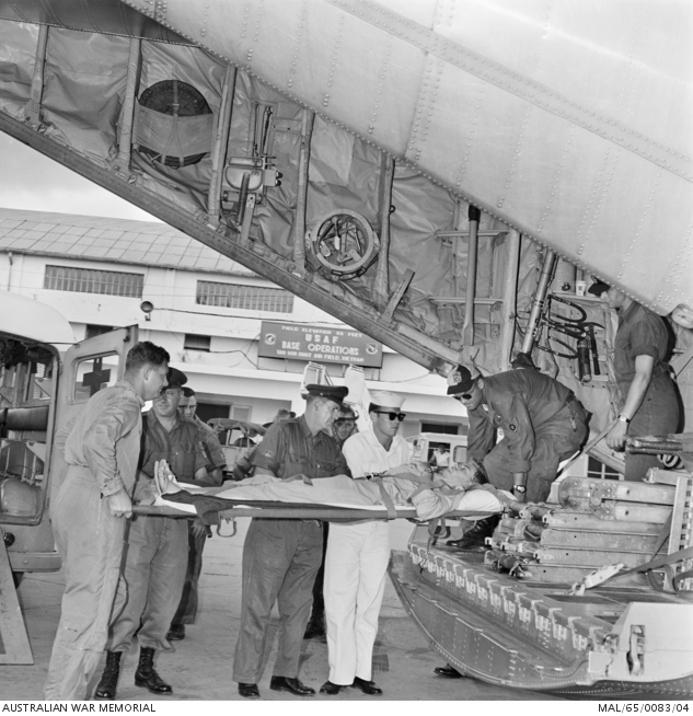 Careful hands lift this Australian casualty aboard a RAAF Hercules at ...