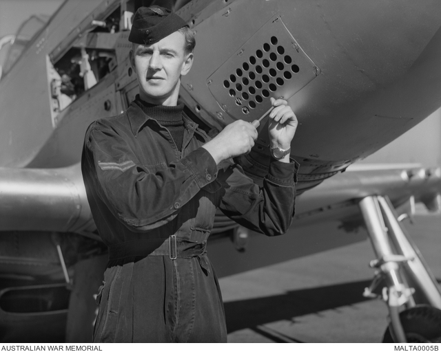 Corporal (Cpl) K A Einam of Stanthorpe, Qld works on a Mustang aircraft ...
