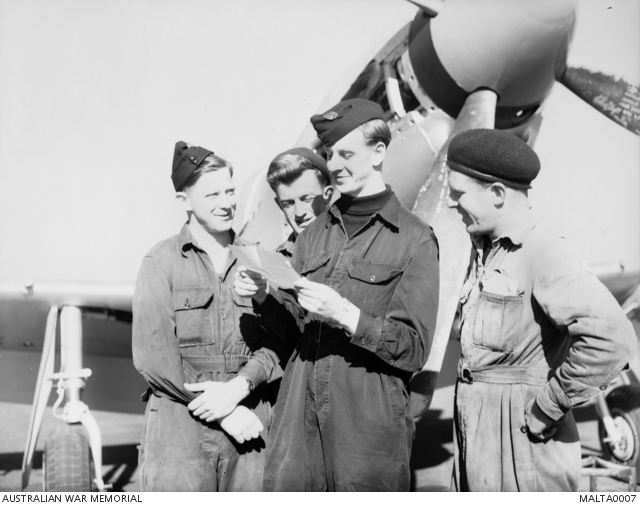 Ground crew members of 78 Fighter Wing RAAF read the citation that was ...