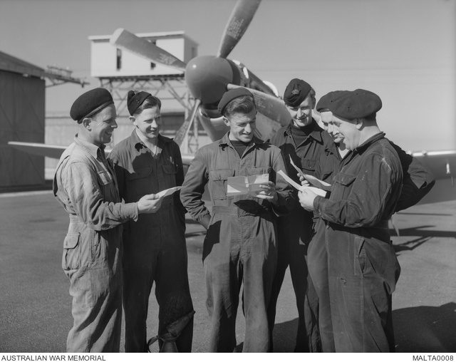 Ground crew members of 78 Fighter Wing RAAF read the citations recently ...