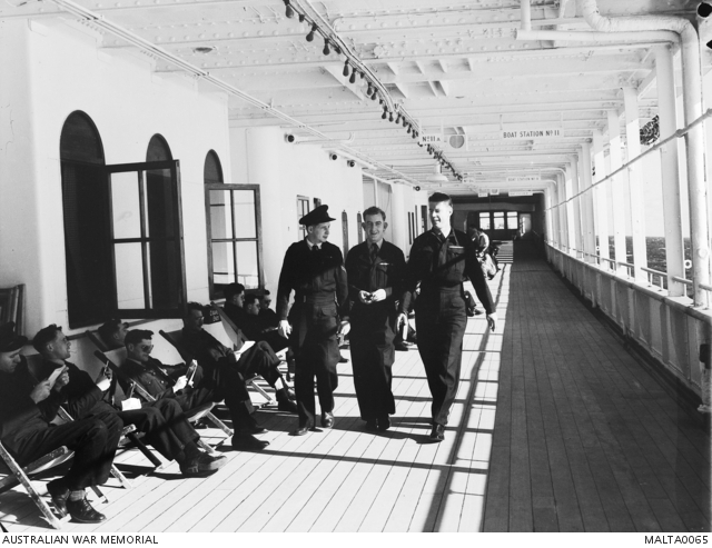 Unidentified members of 78 Fighter Wing RAAF relax in deck chairs ...