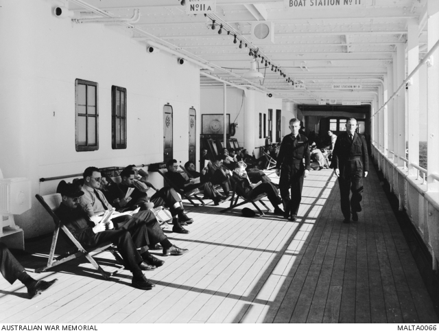 Unidentified members of 78 Fighter Wing RAAF relax in deck chairs ...