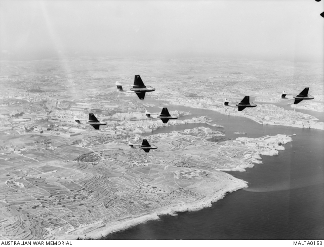A formation of six RAAF Vampire Nine jet aircraft flies over Grand ...